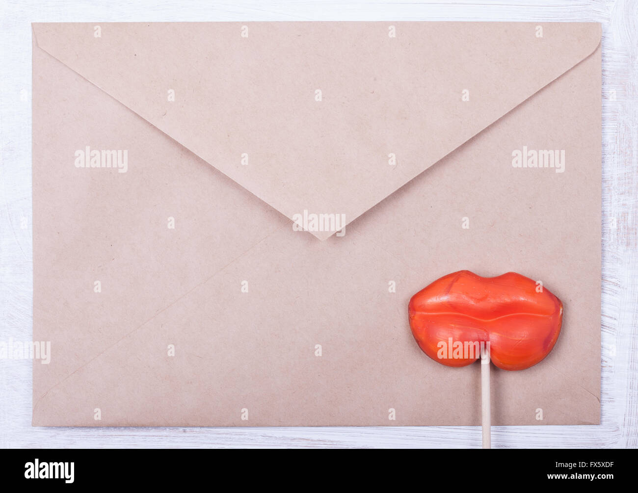 background love letter. the envelope and candy in the form of female ...