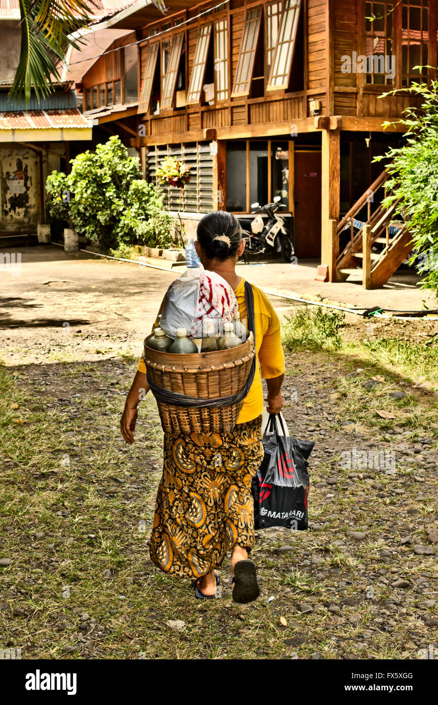 A Javanese woman seller of jamu, traditional Indonesian medicine, which ...
