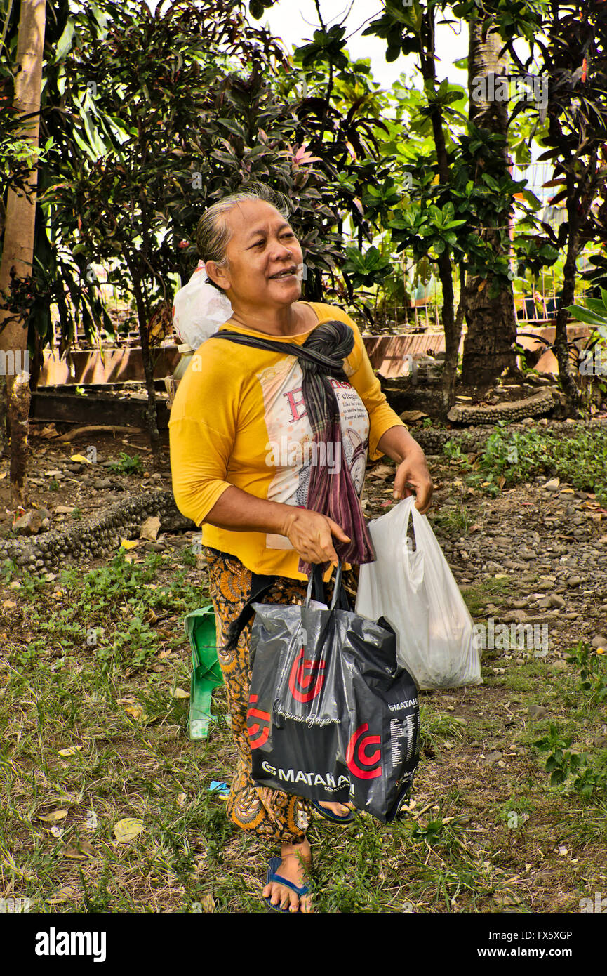 A Javanese woman seller of jamu, traditional Indonesian medicine, which ...