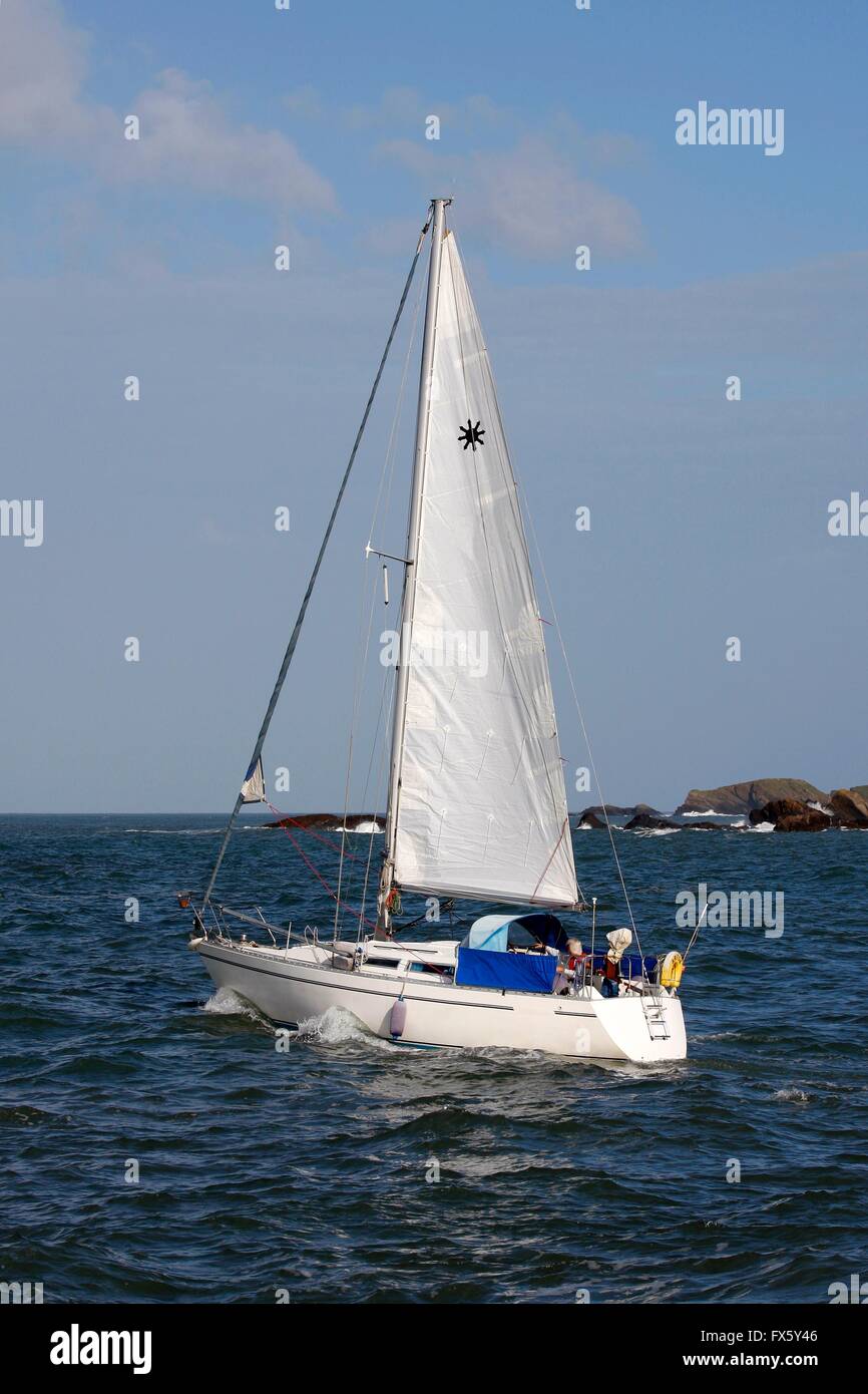 A small yacht sailing on the sea Stock Photo - Alamy