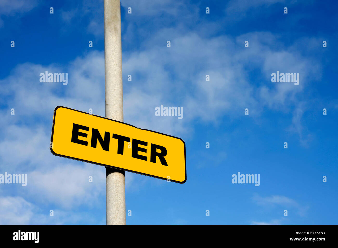 Yellow enter sign against a blue sky Stock Photo - Alamy