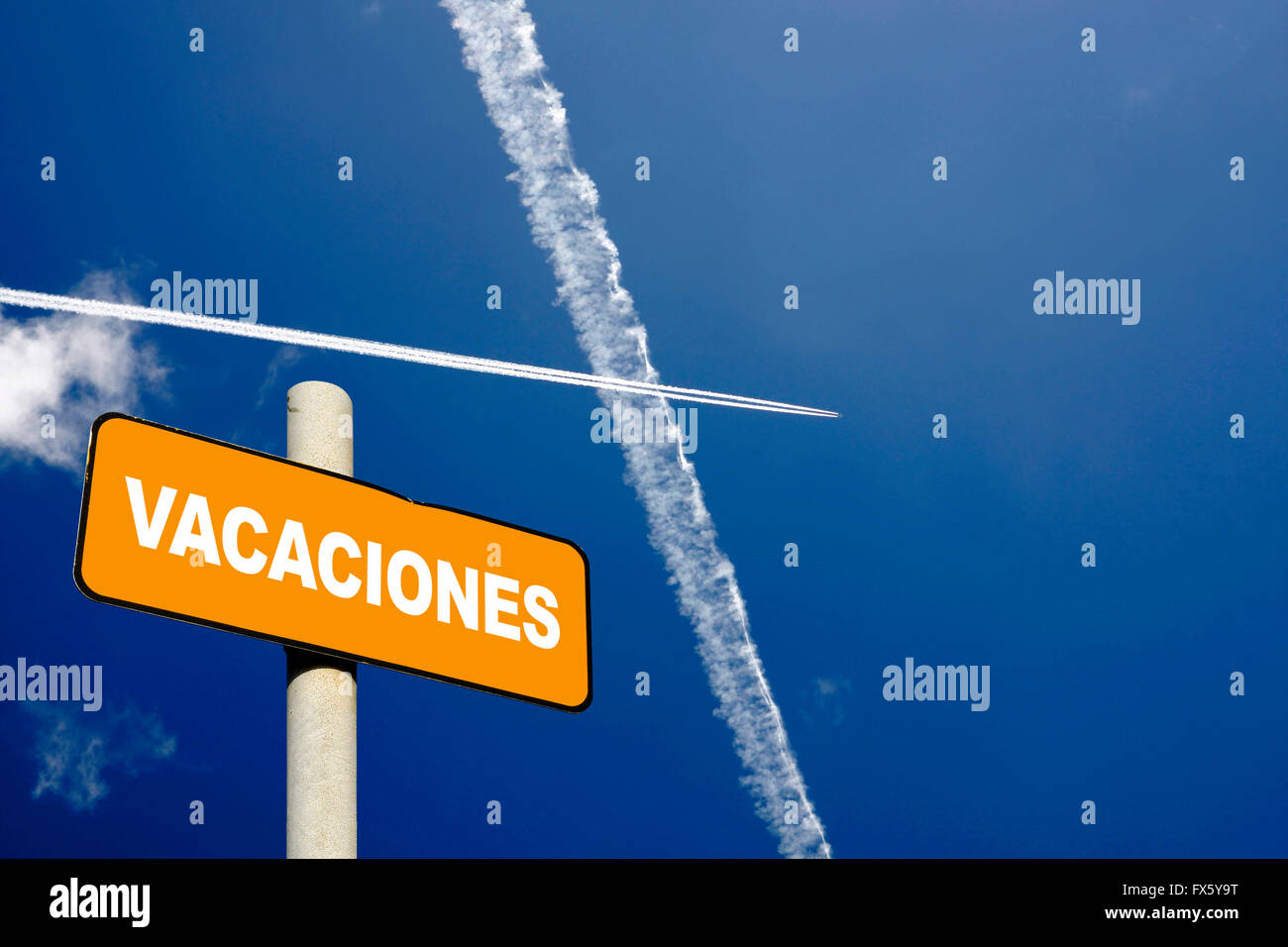 Spanish holiday sign with jet trails crossing in a dark blue sky Stock ...