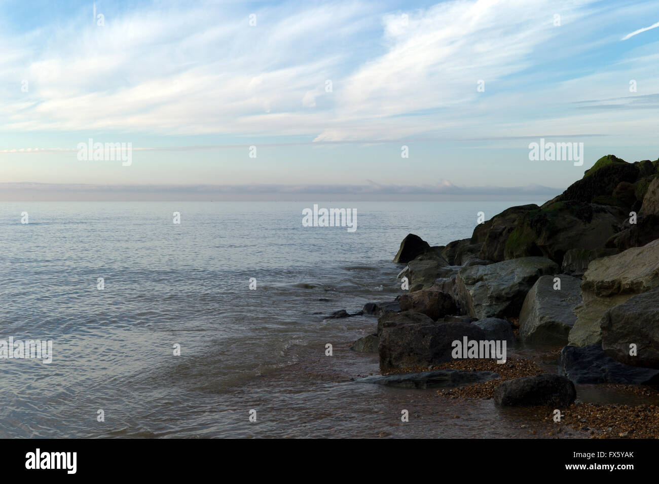 Rocks and calm sea, Sussex Stock Photo - Alamy