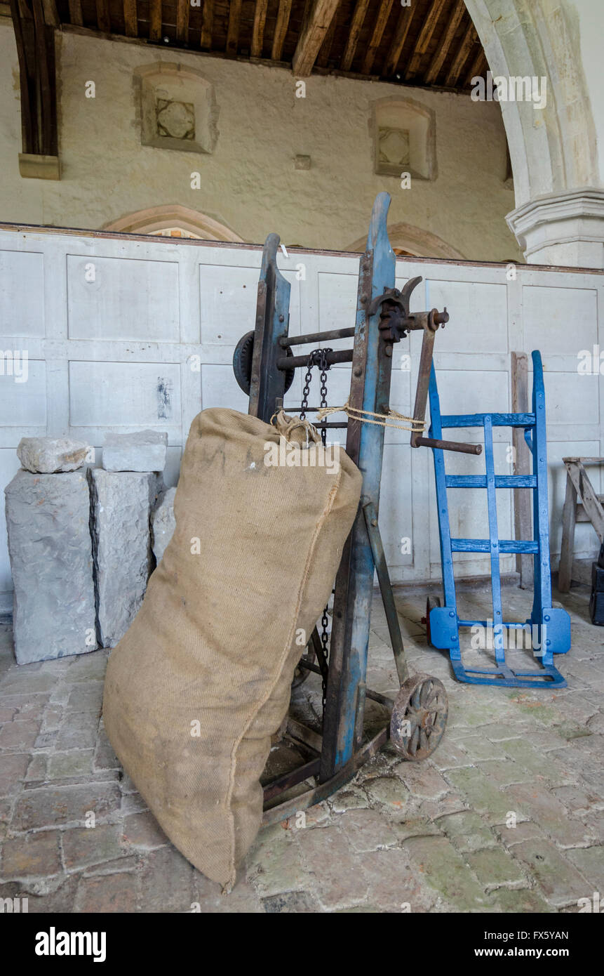 Antique farm equipment, sack barrows with hessian sack on one Stock ...