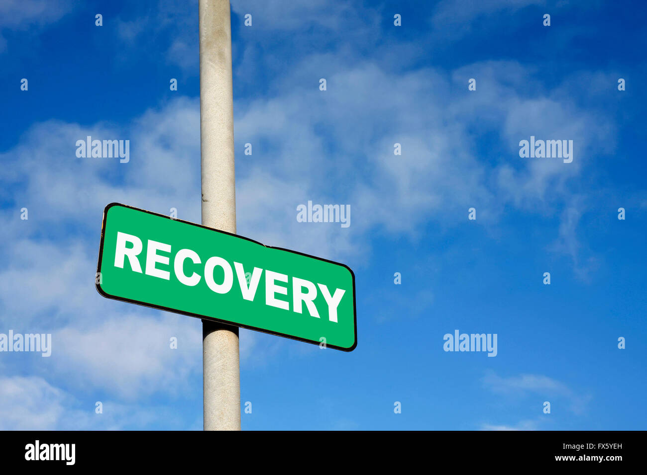 Green recovery sign against a blue sky Stock Photo - Alamy