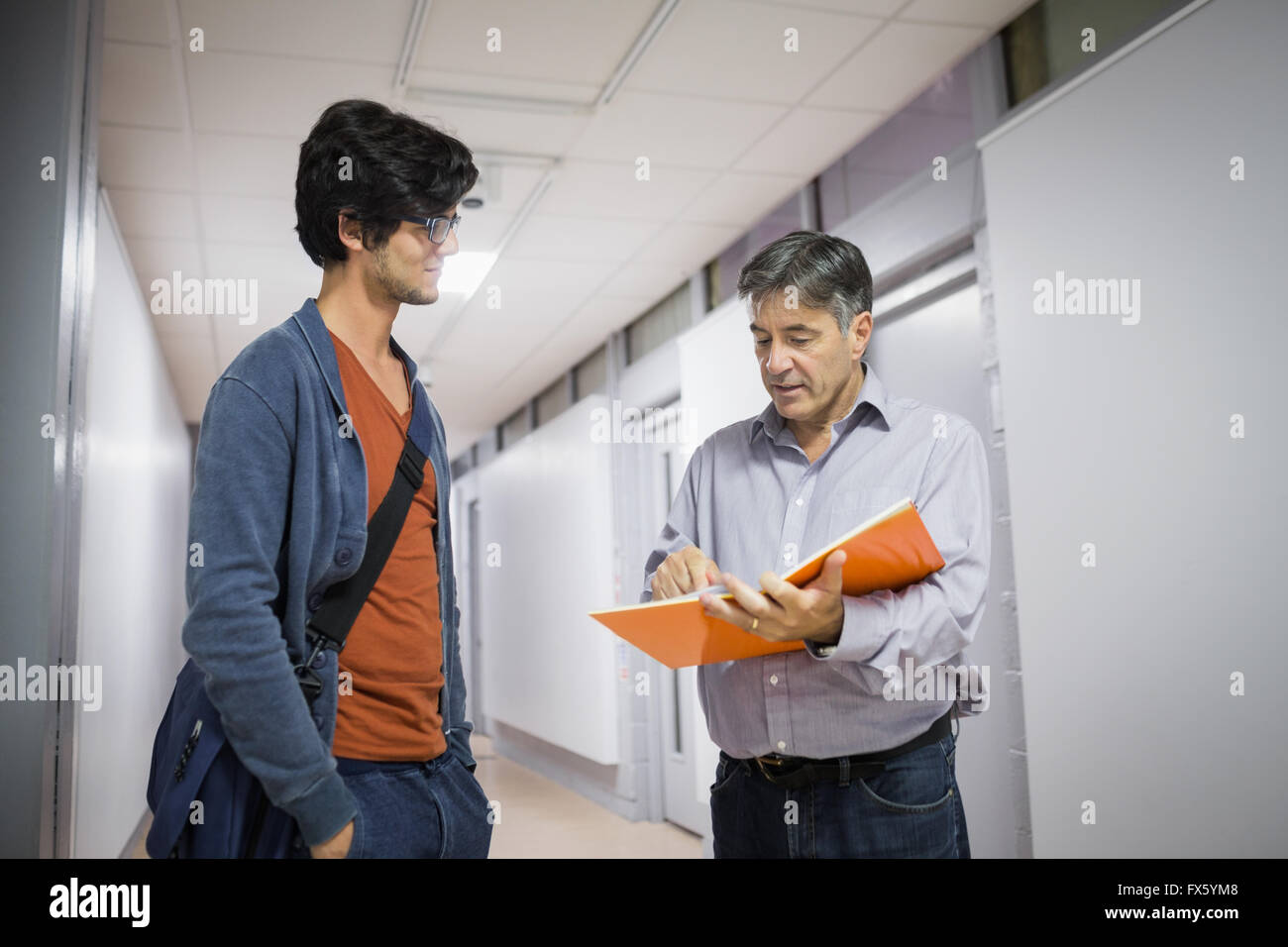 Teacher student talking hallway hi-res stock photography and images - Alamy