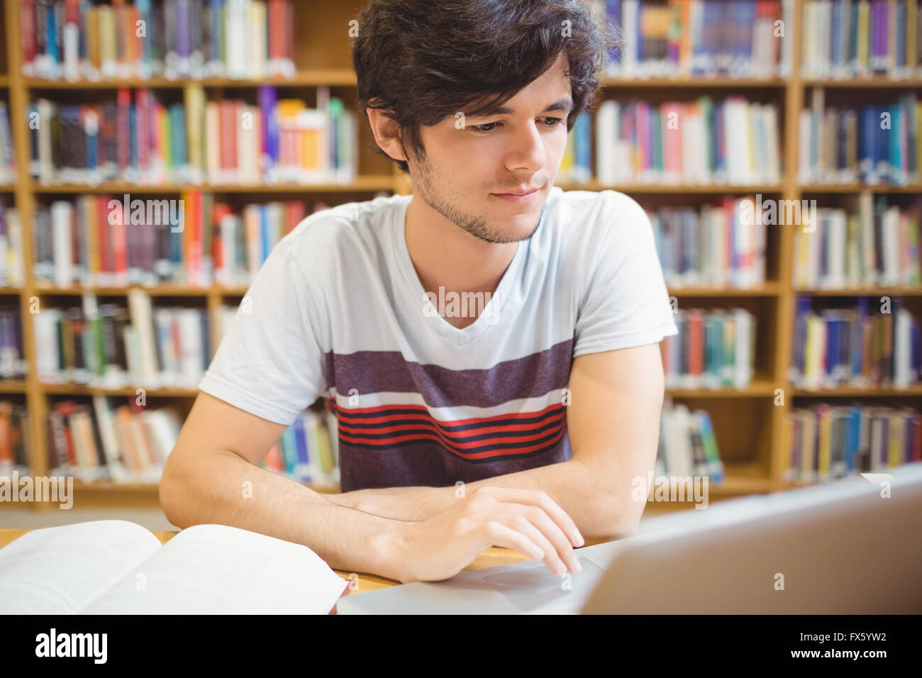 Young student using his laptop Stock Photo - Alamy
