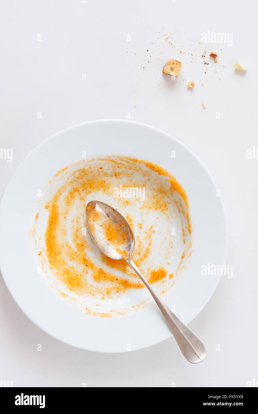 Leftovers of vegetable soup, white plate on white background Stock ...