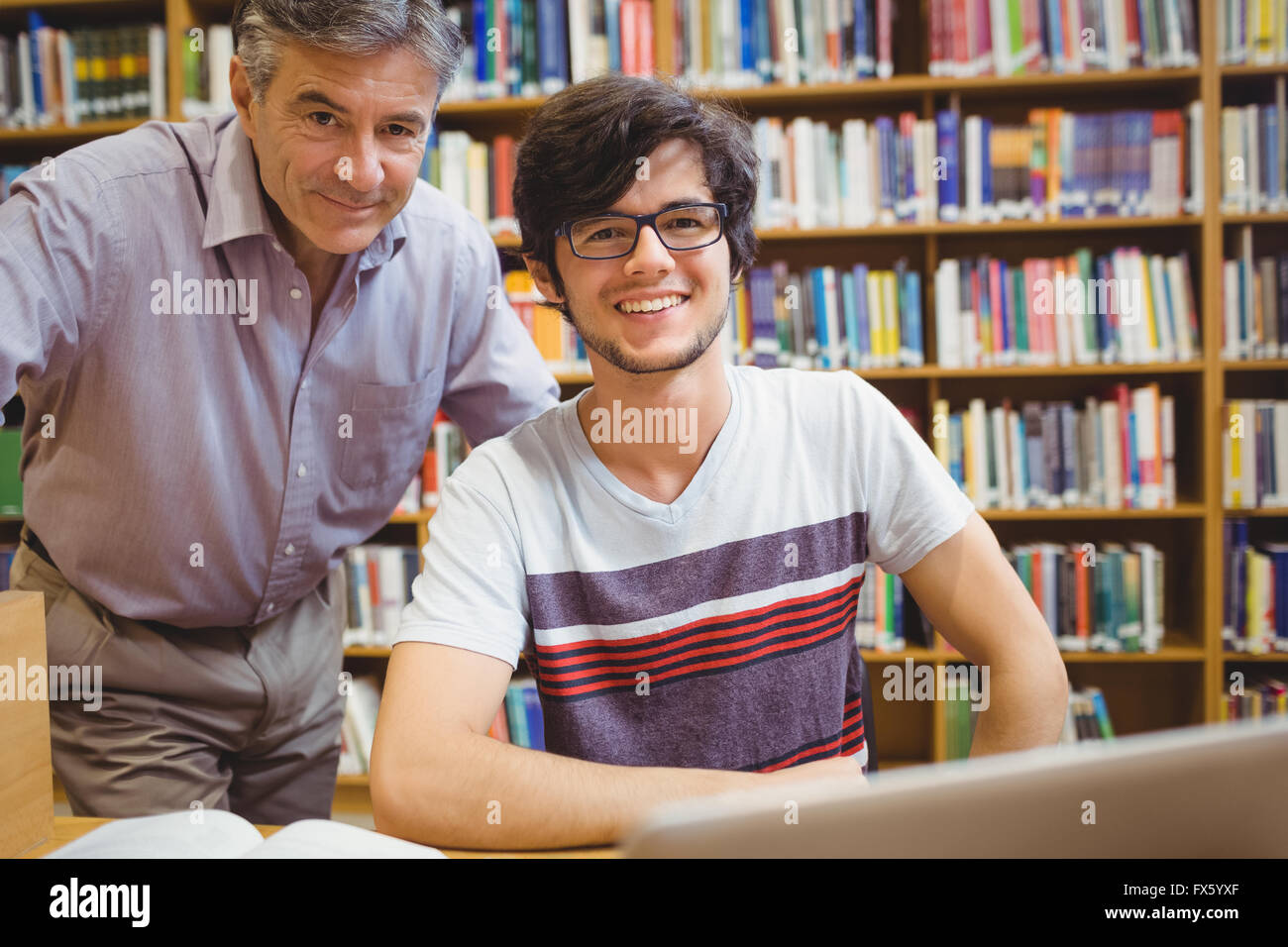 Portrait of smiling student with professor Stock Photo - Alamy