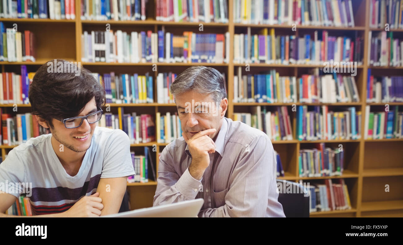Professor assisting a student with studies Stock Photo - Alamy