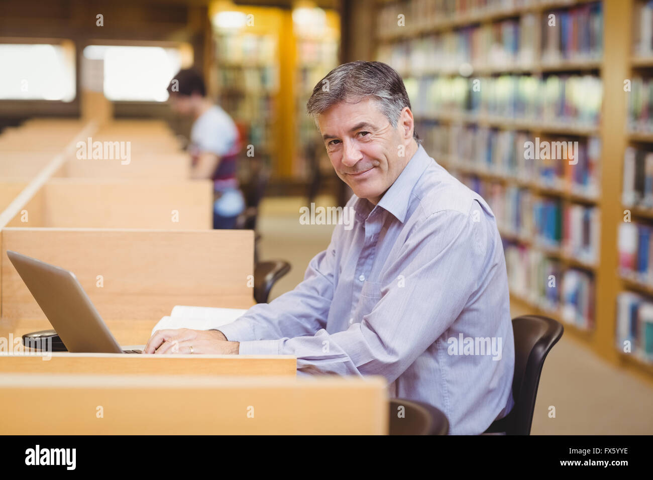 Portrait happy professor sitting desk hi-res stock photography and ...