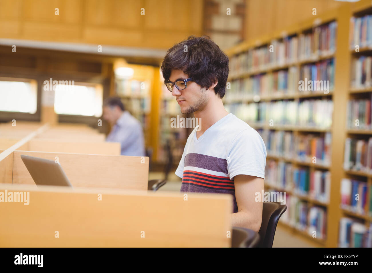 Young student using his laptop Stock Photo - Alamy