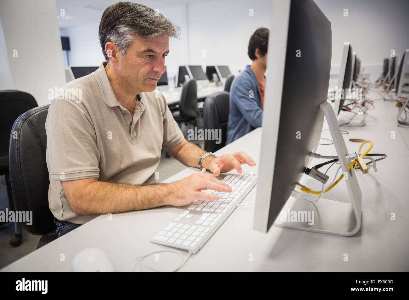 Professor using computer Stock Photo - Alamy