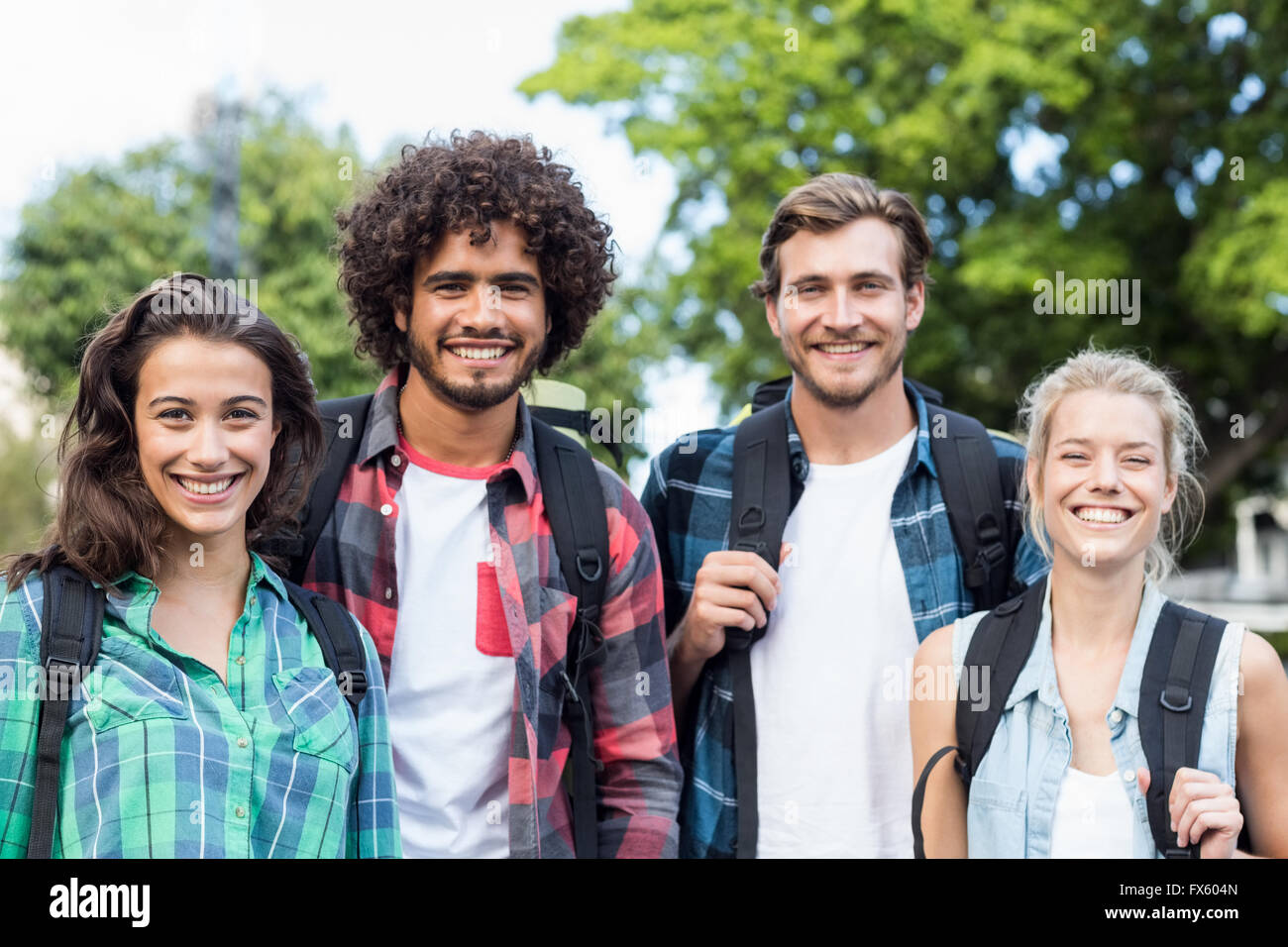 Group of friends standing together Stock Photo - Alamy