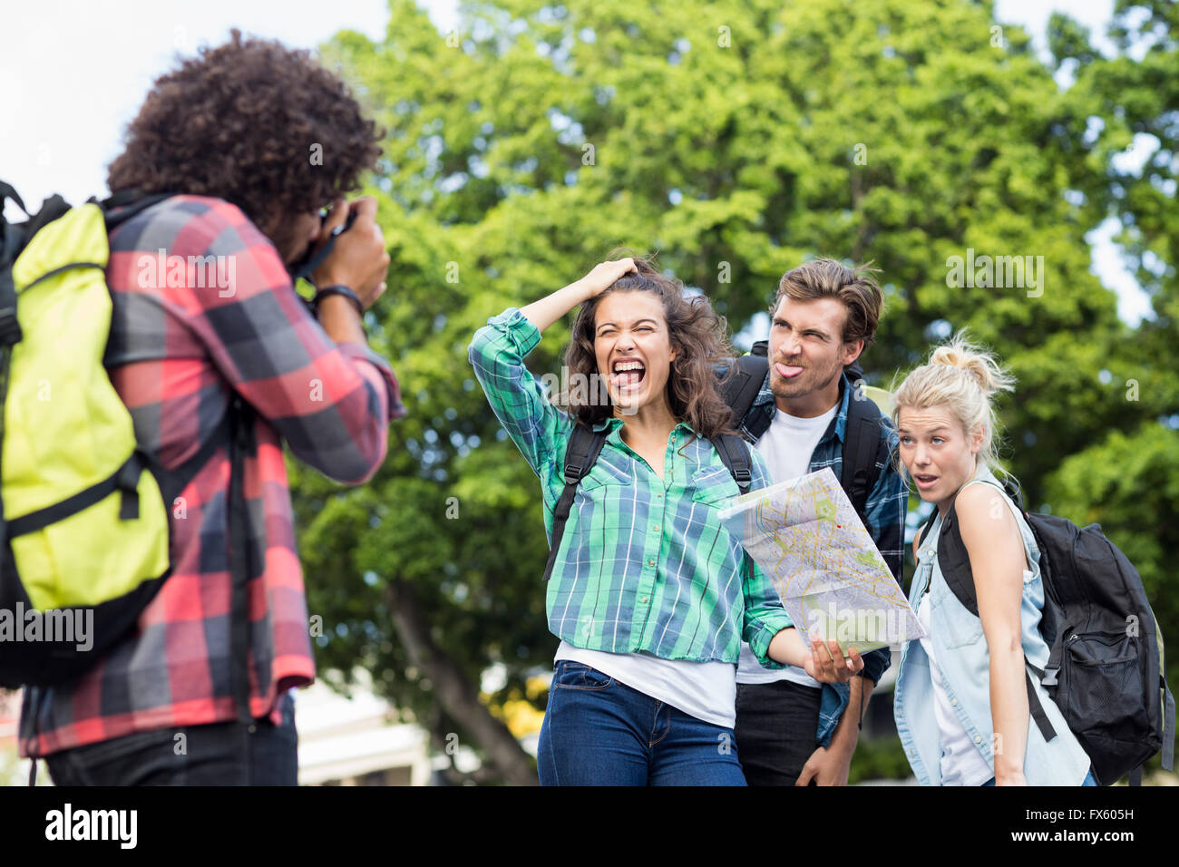 Man taking photo of his friends Stock Photo - Alamy