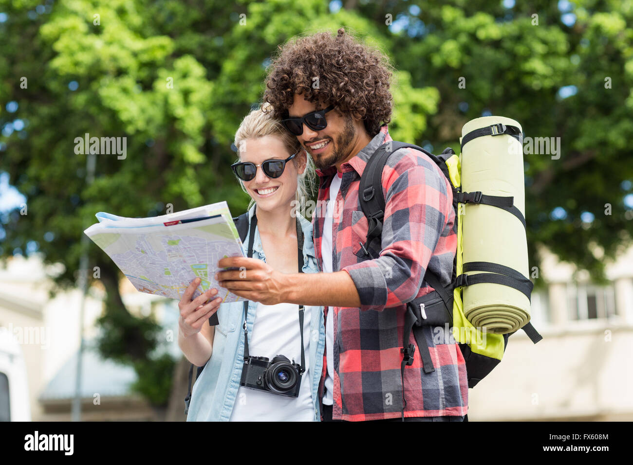 Young couple looking at map Stock Photo - Alamy