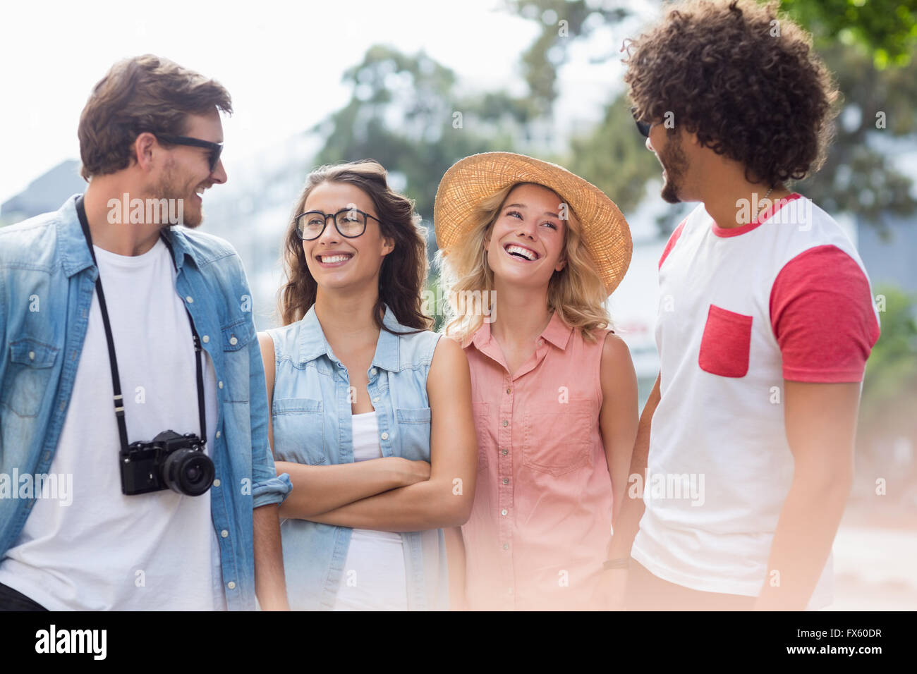 Friends interacting with each other Stock Photo - Alamy