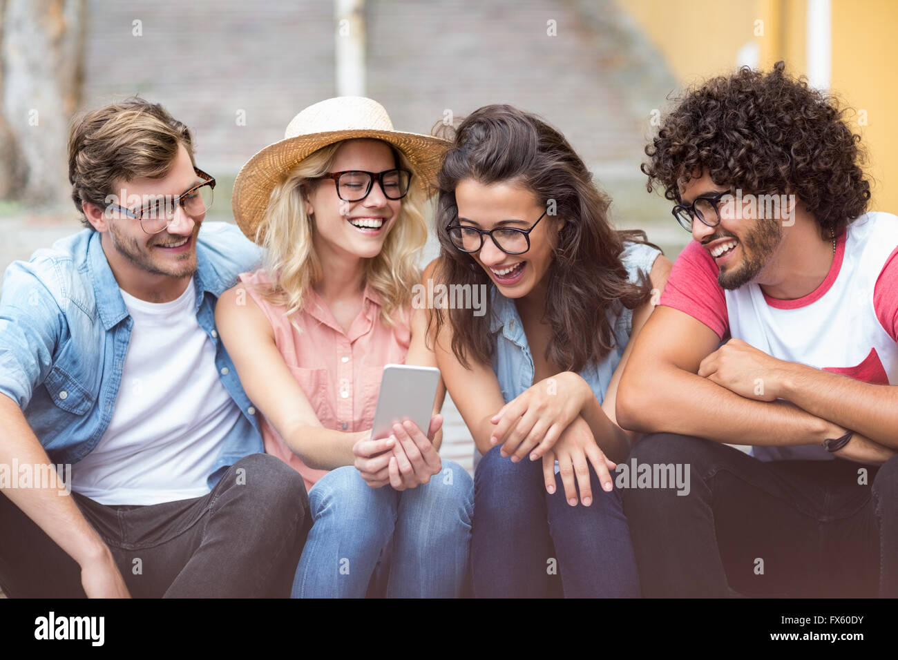 Friends using mobile phone Stock Photo - Alamy