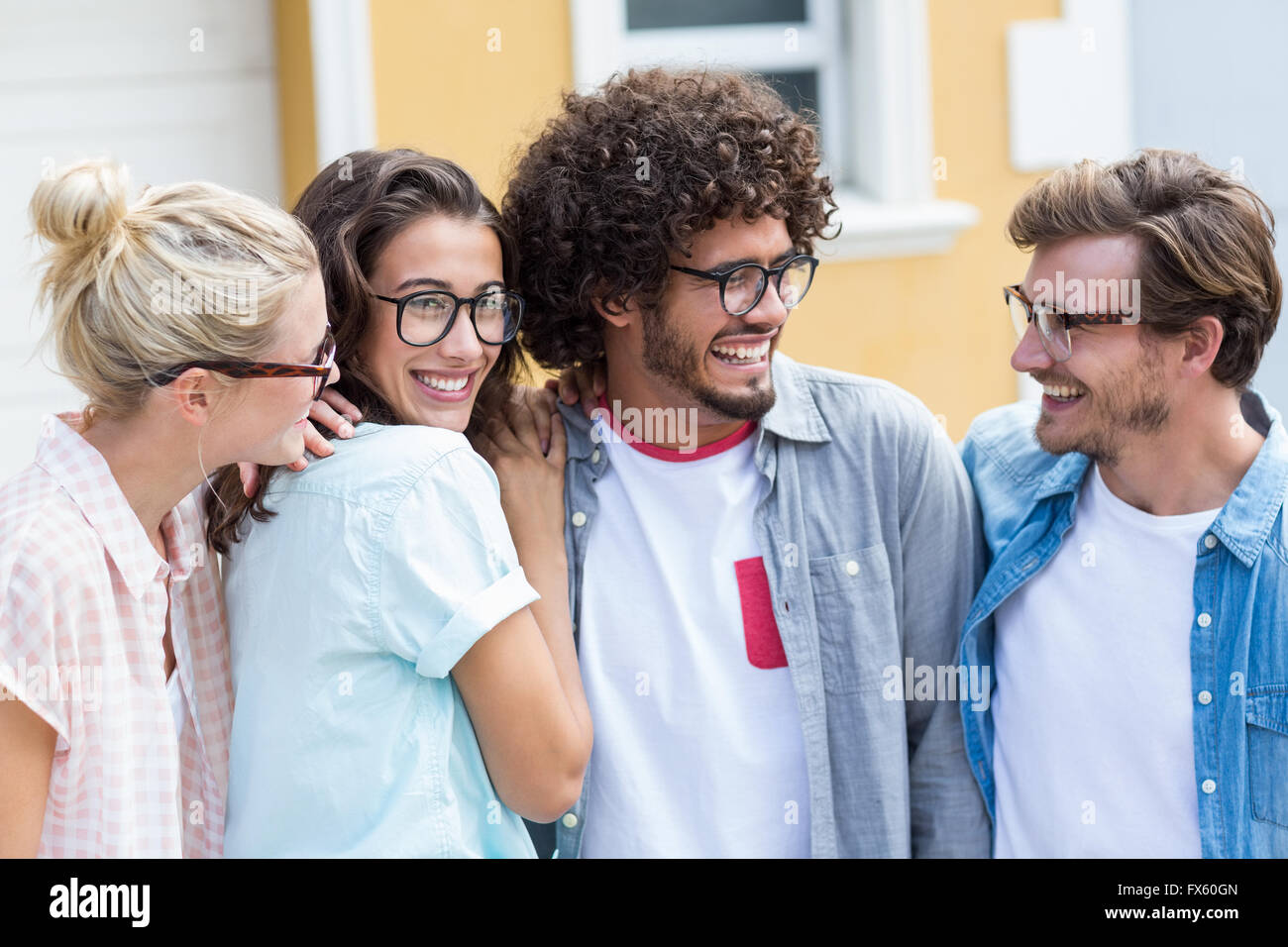 Friends interacting with each other Stock Photo - Alamy