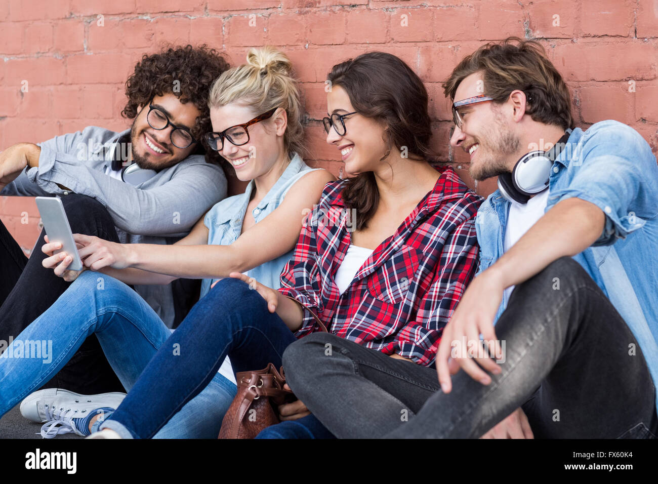 Friends using mobile phone Stock Photo - Alamy