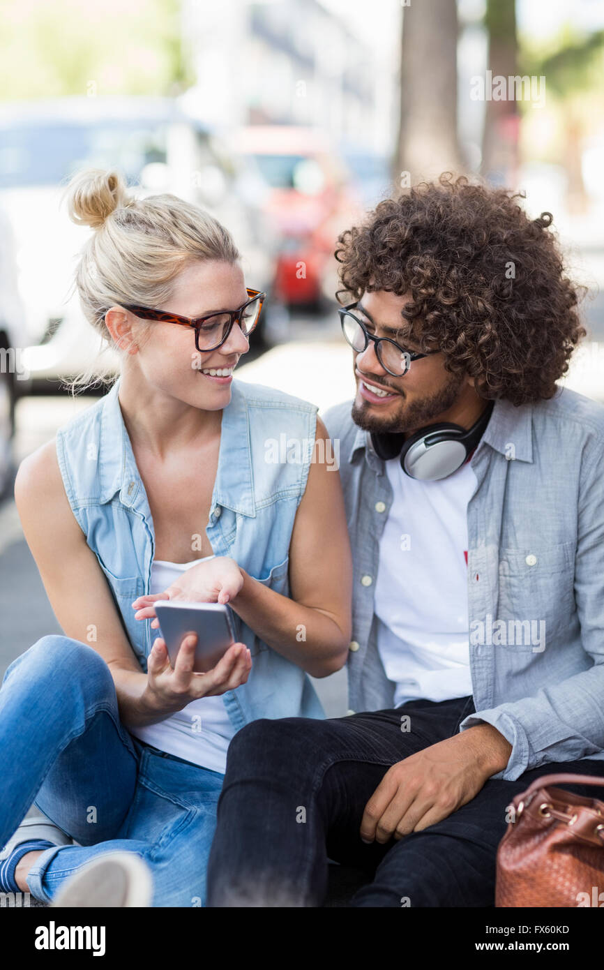Couple using mobile phone Stock Photo - Alamy