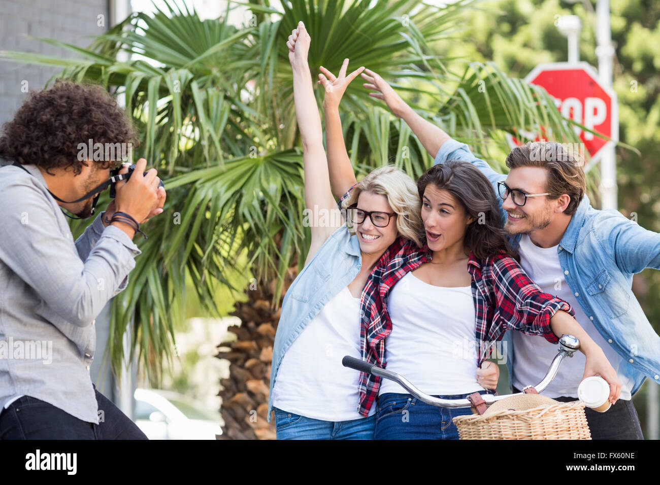 Man taking photo of his friends Stock Photo - Alamy