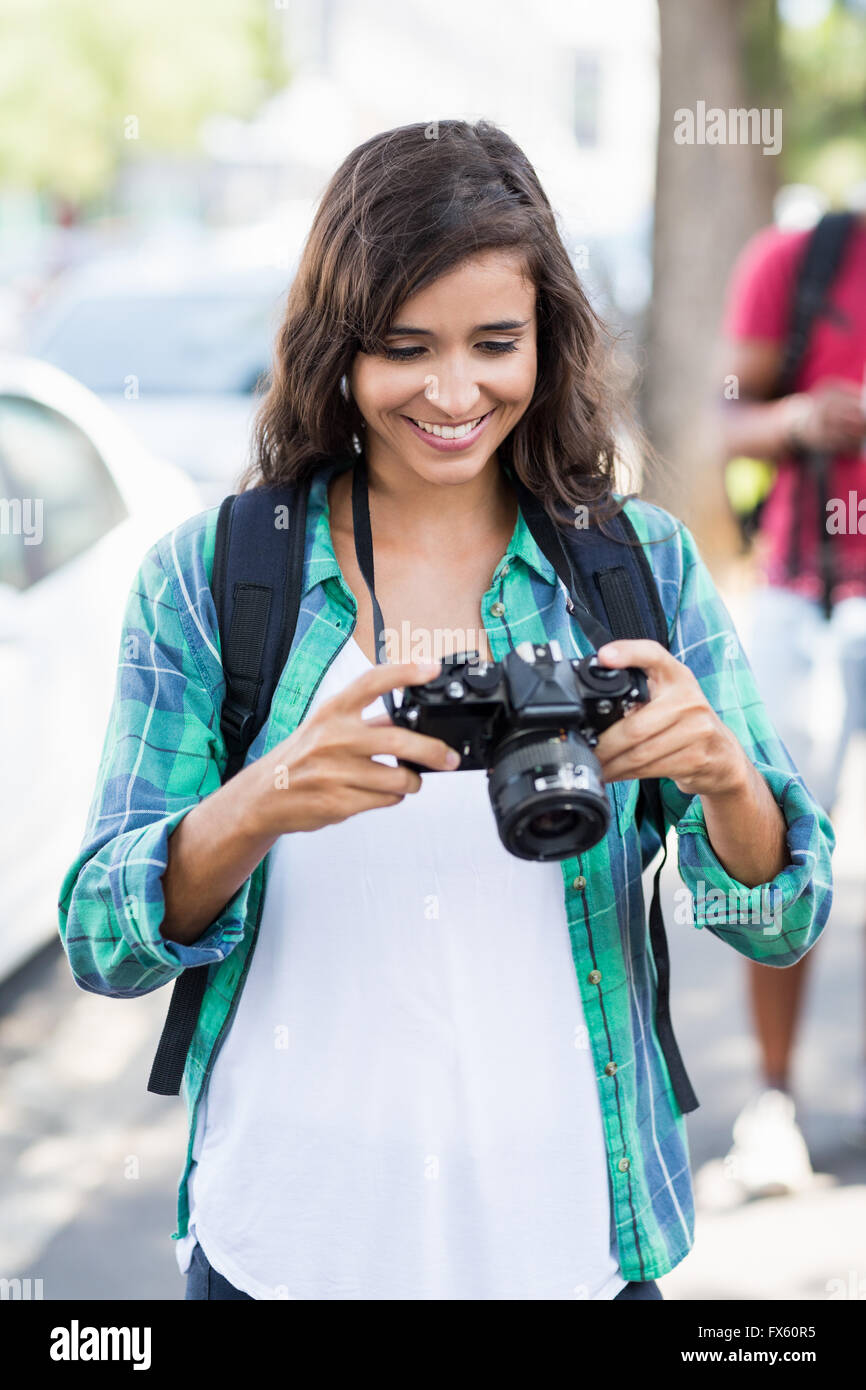 Young woman looking into camera Stock Photo - Alamy