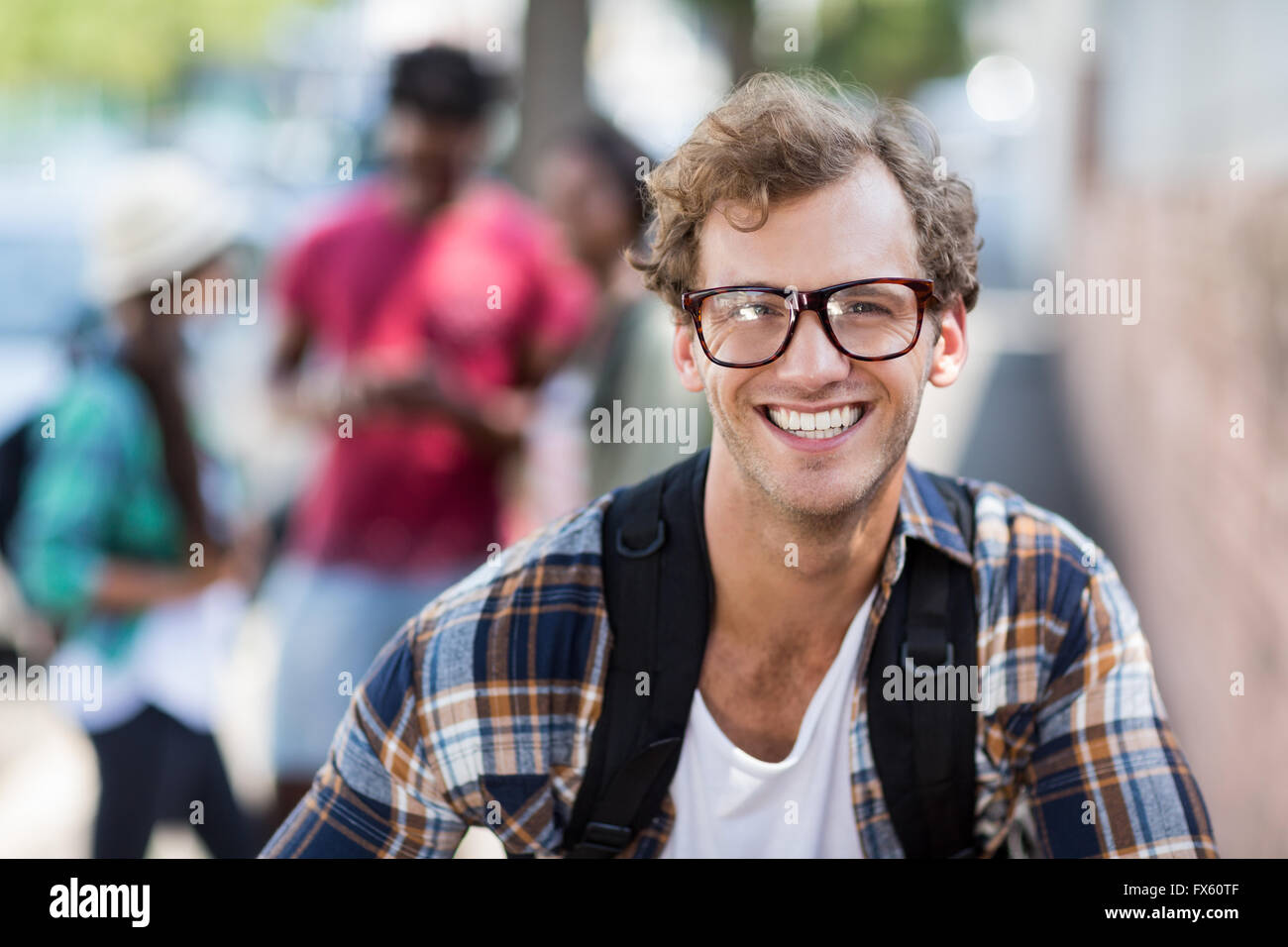 Portrait of young man smiling Stock Photo - Alamy