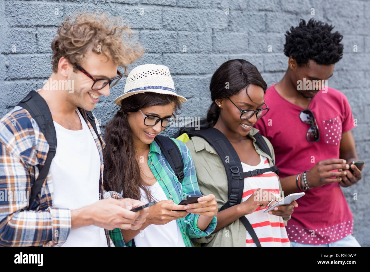 Friends using mobile phone Stock Photo - Alamy