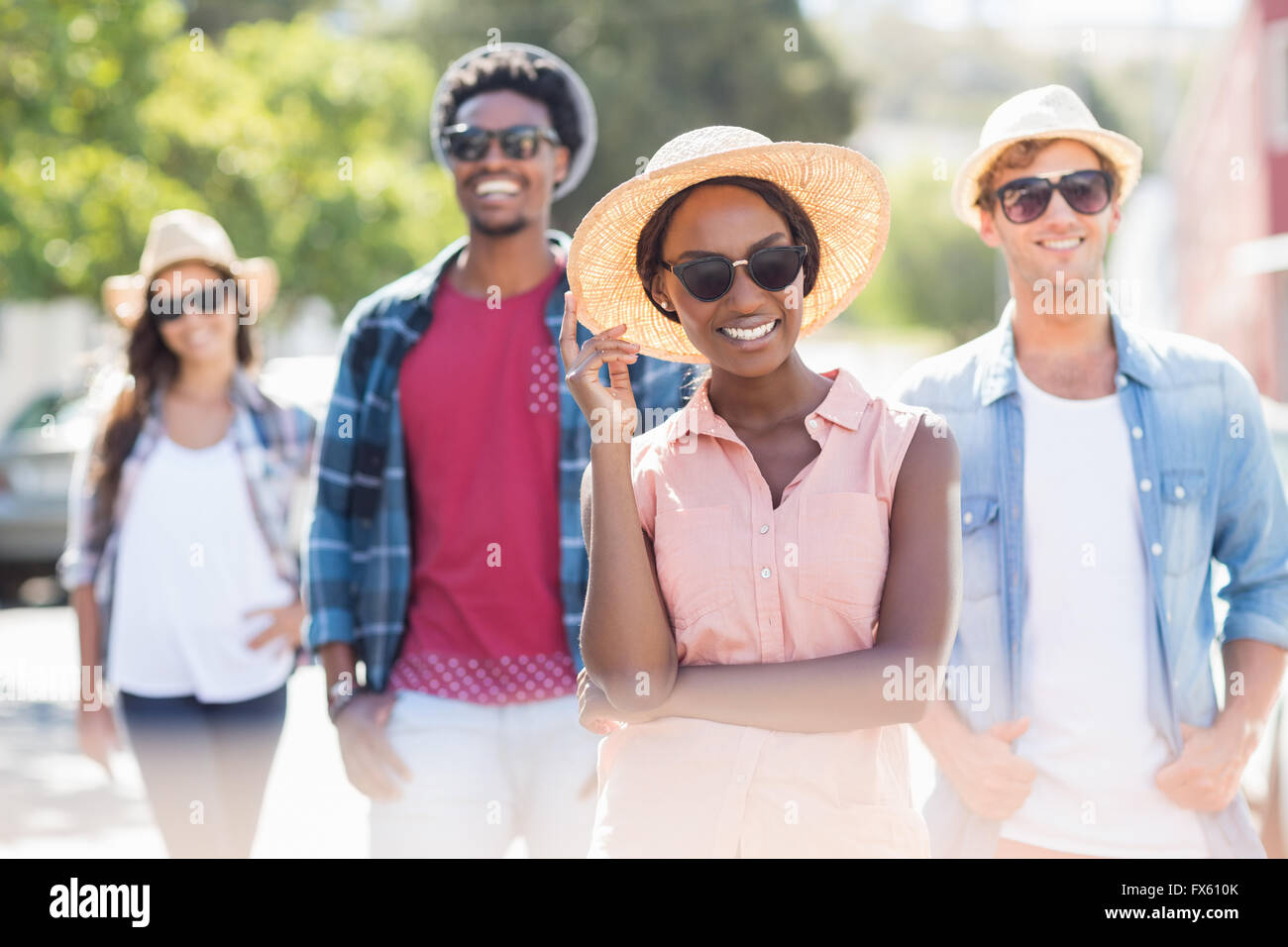 Friends in smiling at camera Stock Photo - Alamy