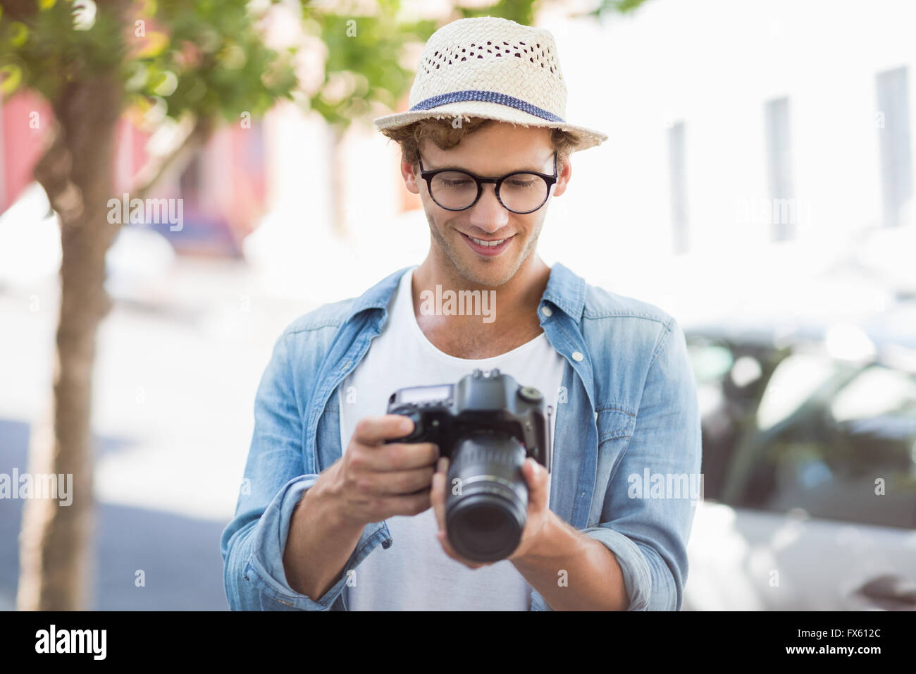Young man looking into camera Stock Photo - Alamy