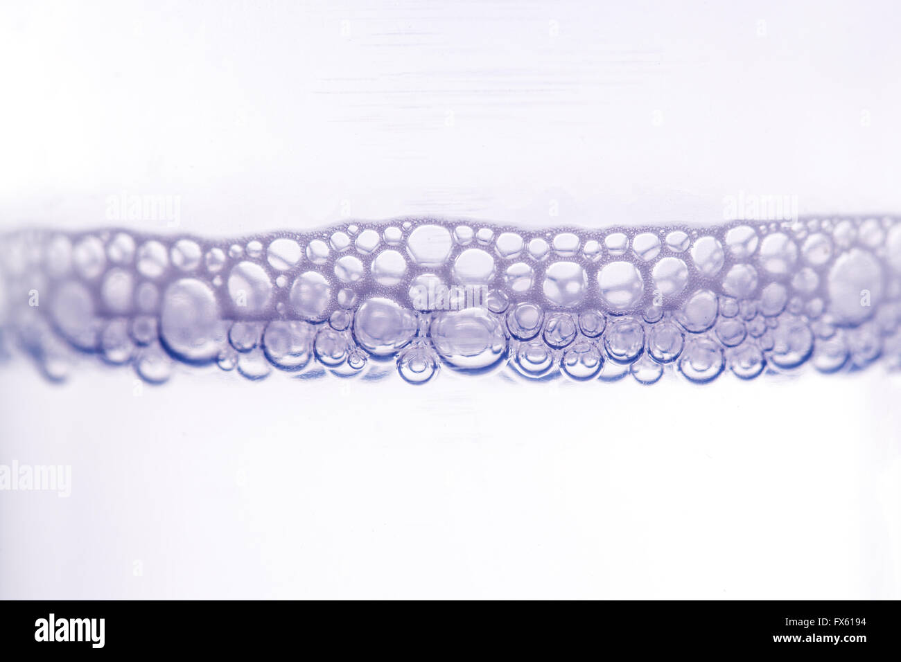 Shampoo bubbles in closeup as background horizontal Stock Photo - Alamy