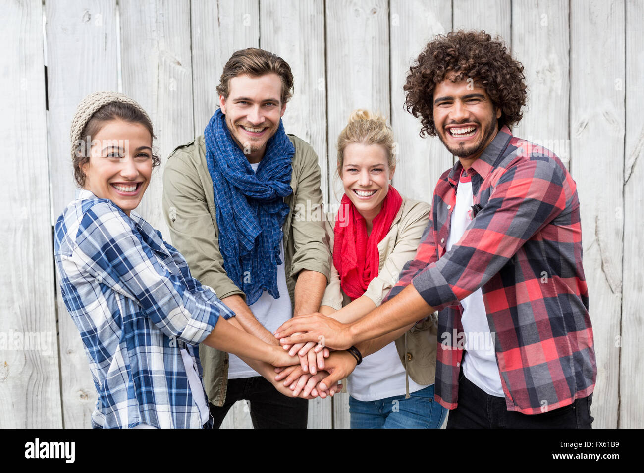 Friends putting their hands together Stock Photo - Alamy