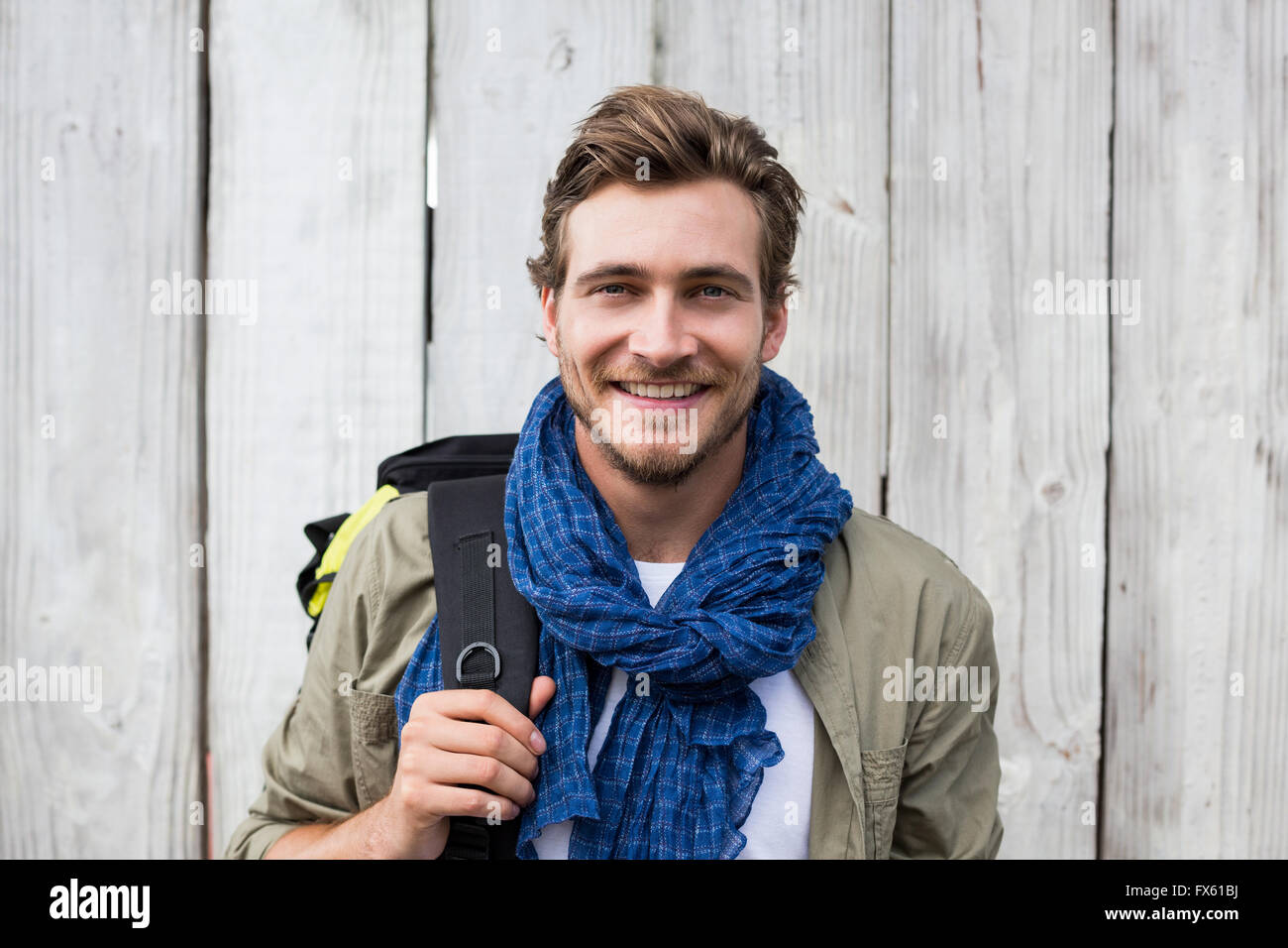 Young man carrying backpack Stock Photo - Alamy