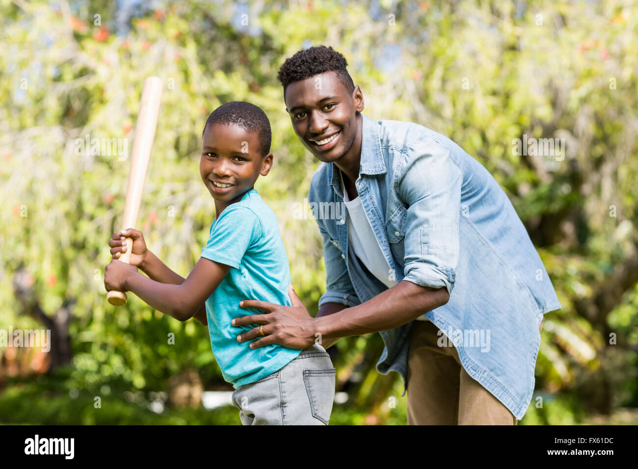 Happy family playing together Stock Photo - Alamy