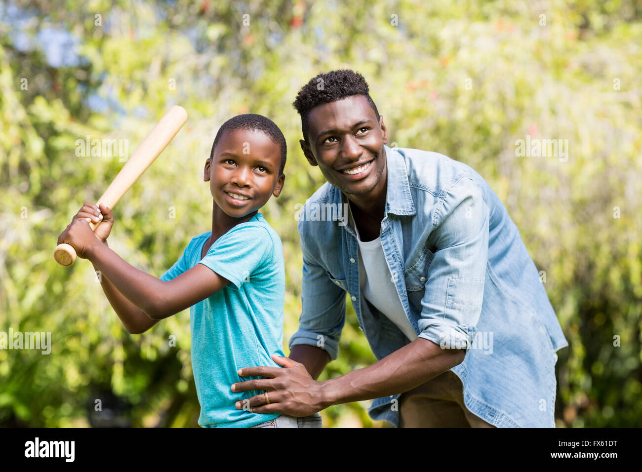 Happy family playing together Stock Photo - Alamy