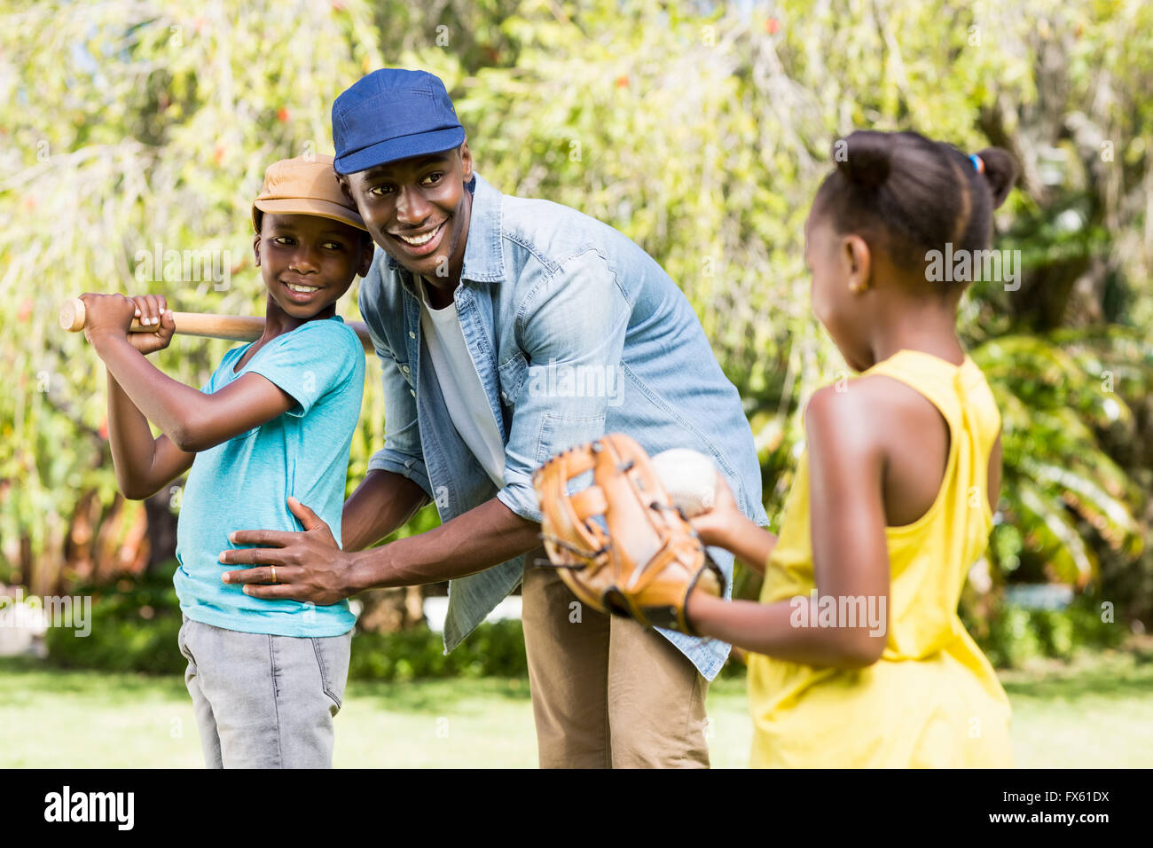 Happy family playing together Stock Photo - Alamy
