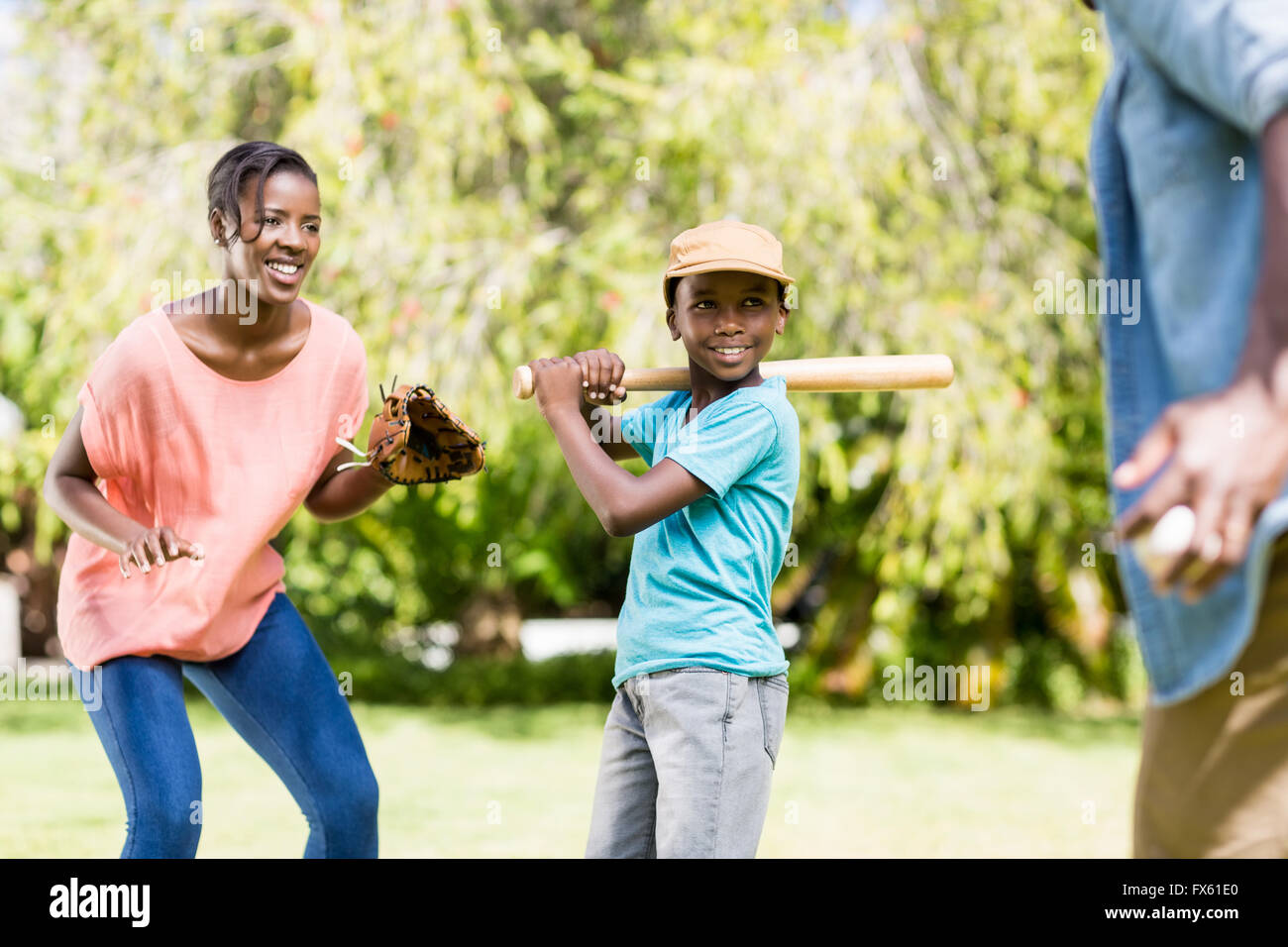 Happy family playing together Stock Photo - Alamy
