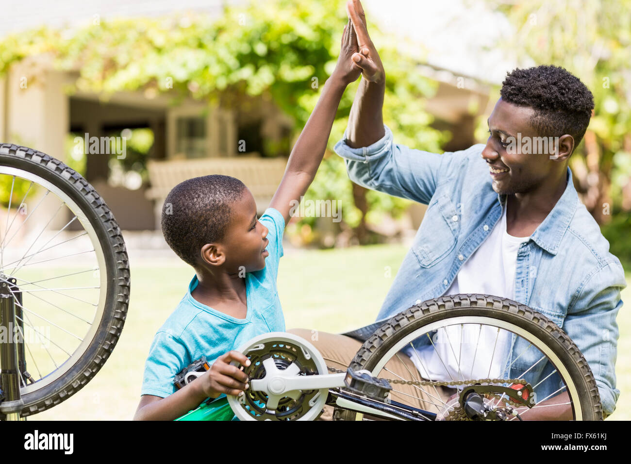 Happy family enjoying together Stock Photo - Alamy
