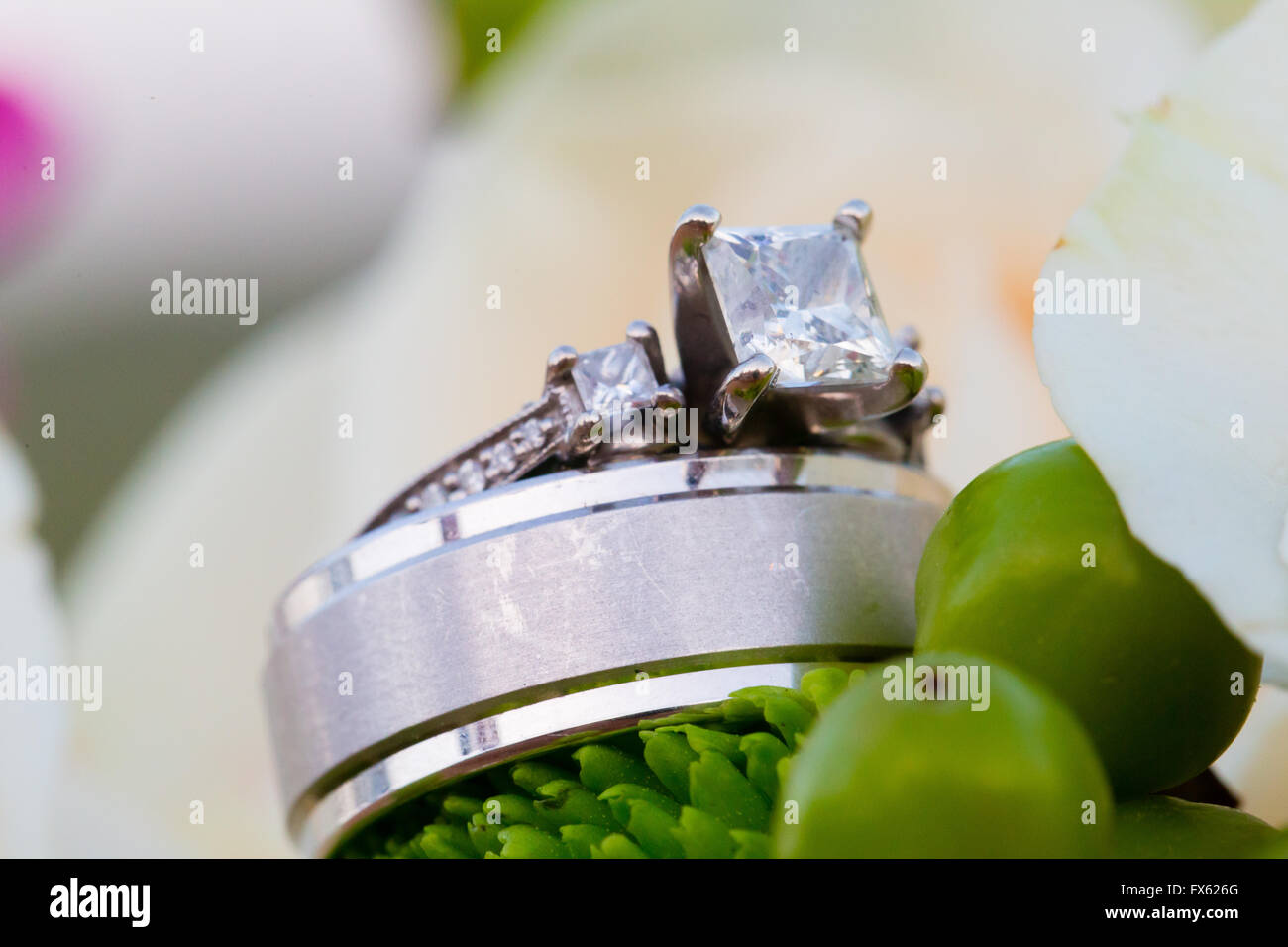 Wedding rings photographed outdoors at a ceremony and reception in ...