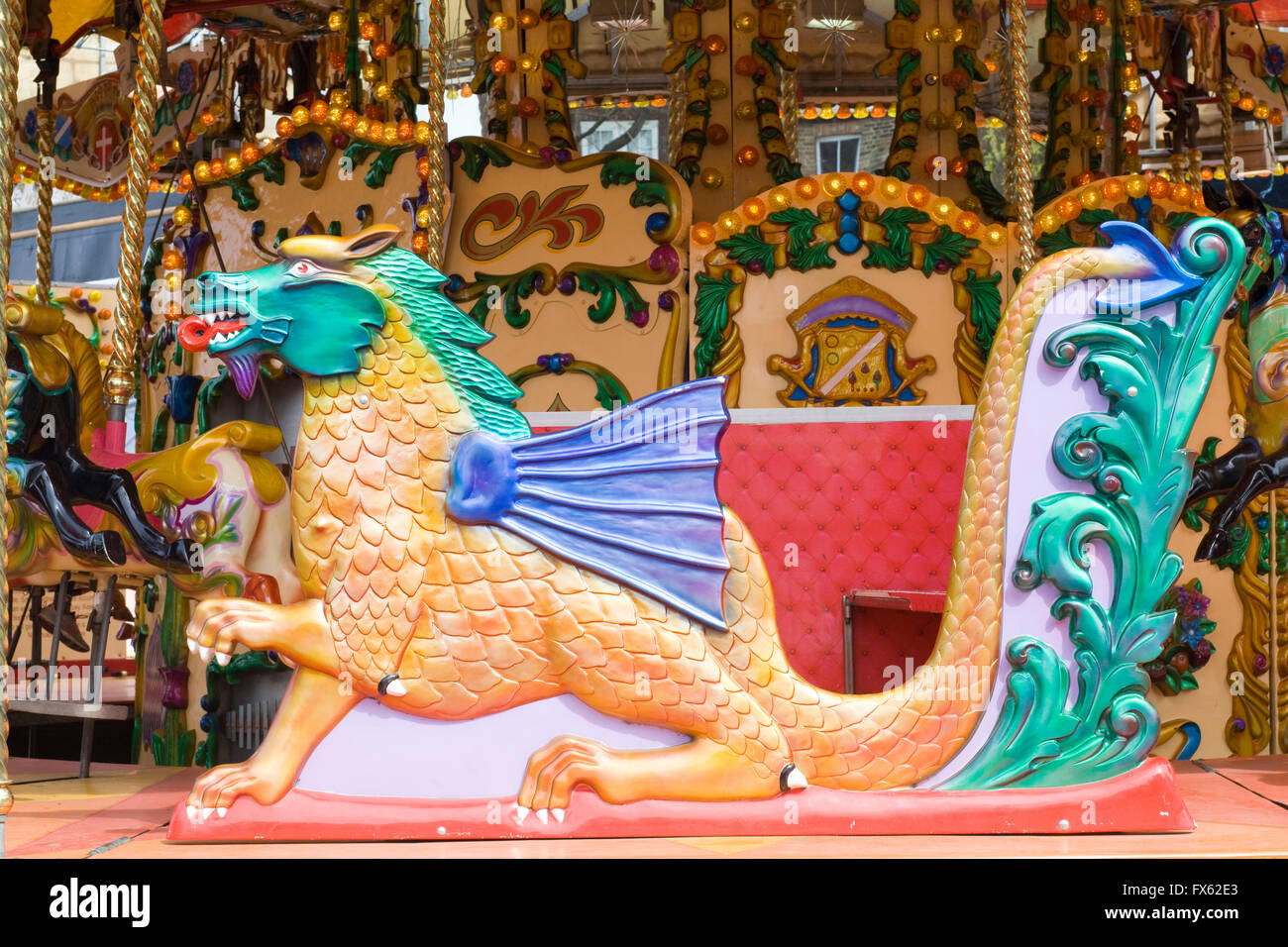 Dragon merry go round Stock Photo - Alamy