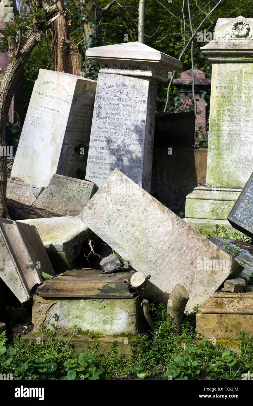 Damaged and fallen old graves and headstones in an Ancient Burial ...