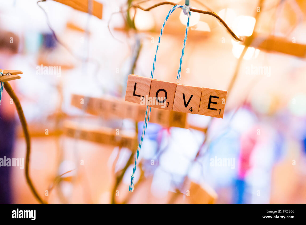 Scrabble letters at a wedding reception are used as decor to spell out ...