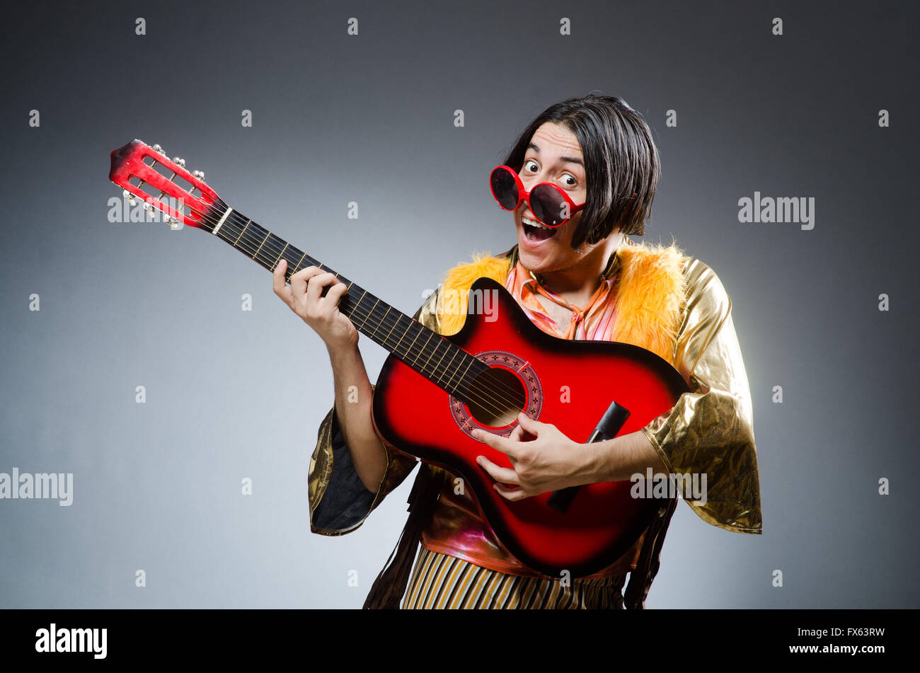 Man with guitar in musical concept Stock Photo - Alamy