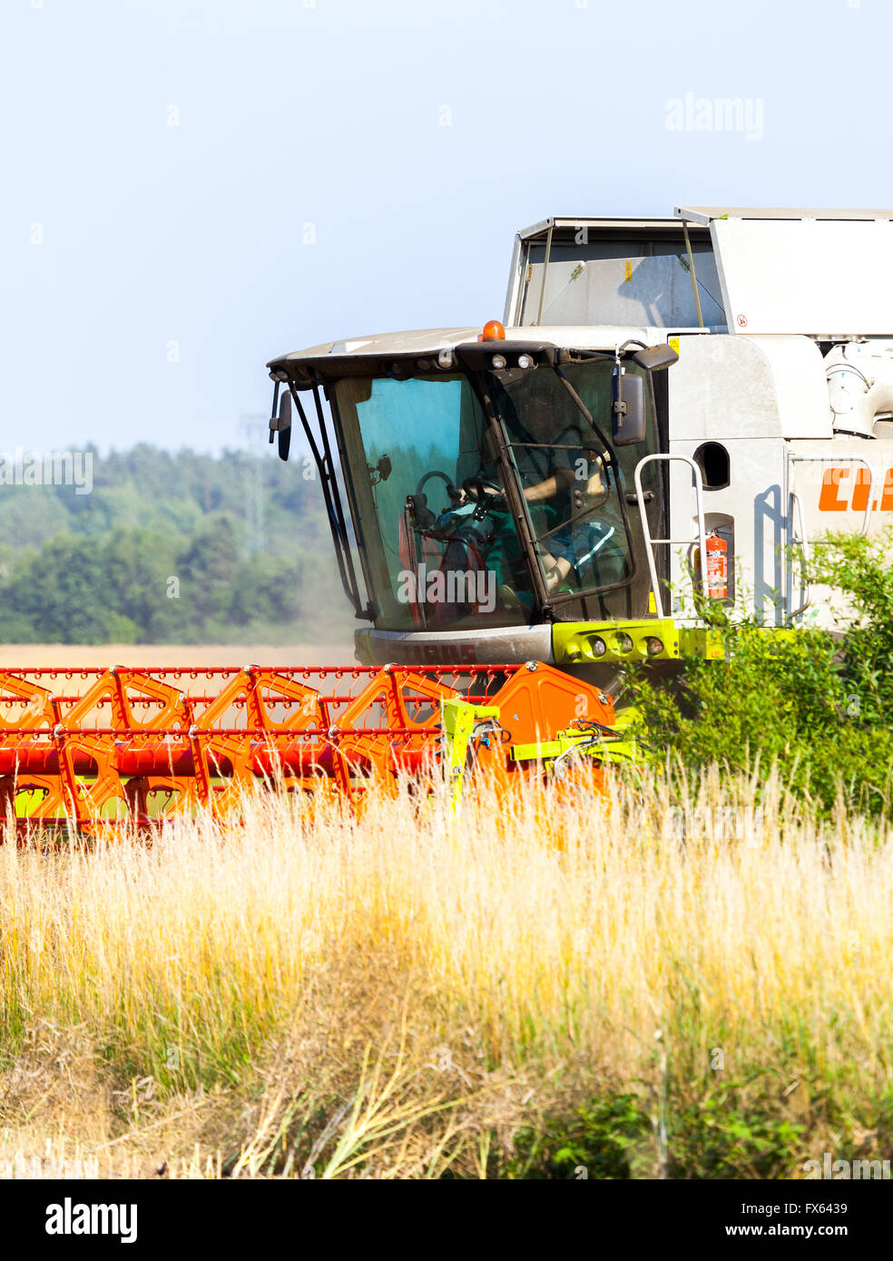 german havester works on a corn field Stock Photo - Alamy