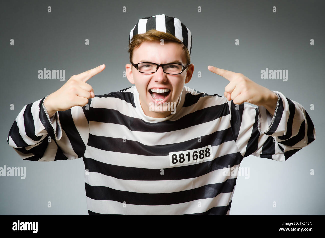 Funny prisoner in prison concept Stock Photo - Alamy