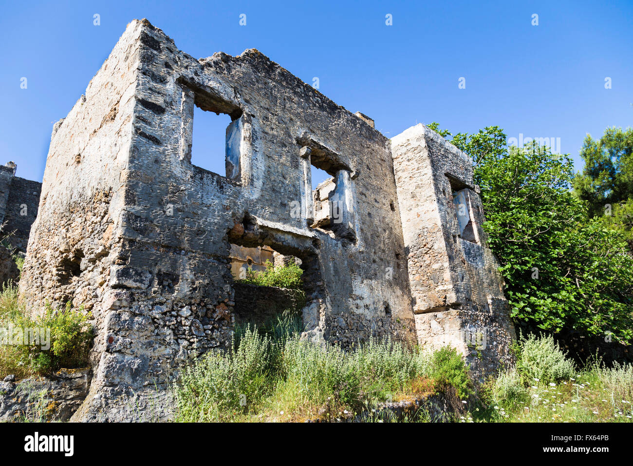 Empty house at ghost town village Kayakoy ruins near Fethiye in Turkey ...