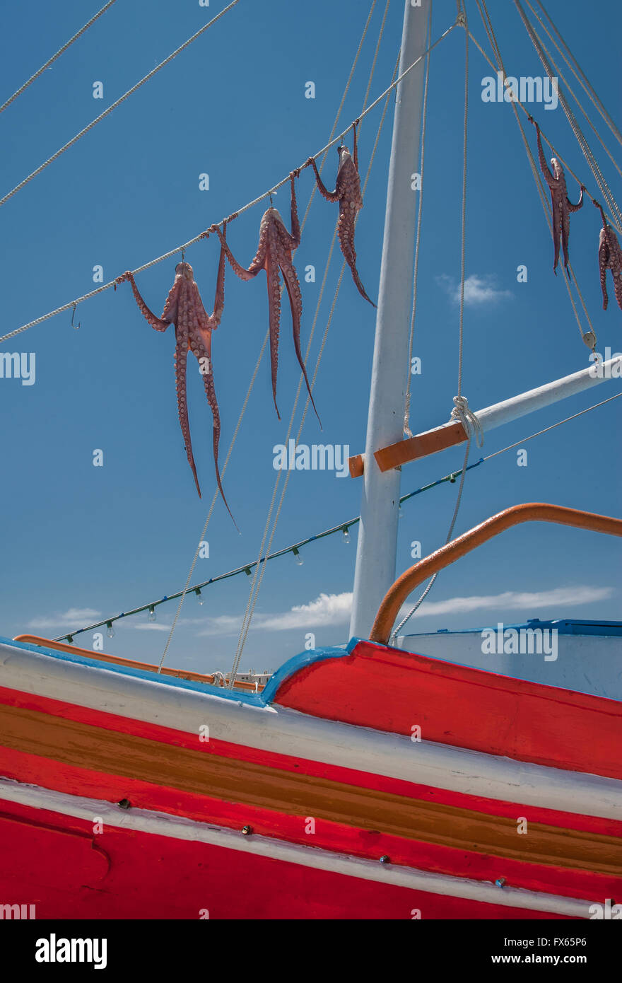 Low angle view of octopus hanging from boat rigging Stock Photo - Alamy