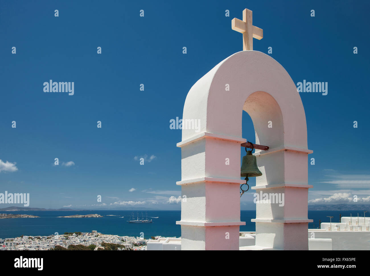 Bell arch and Mykonos cityscape under blue sky, Cyclades, Greece Stock ...