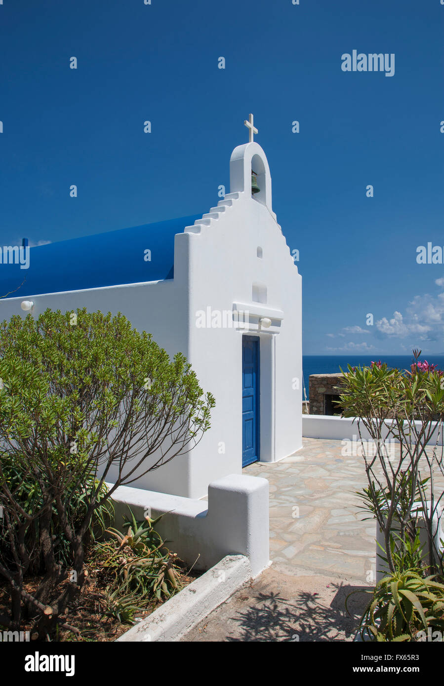 Traditional church entrance and walkway under blue sky Stock Photo - Alamy